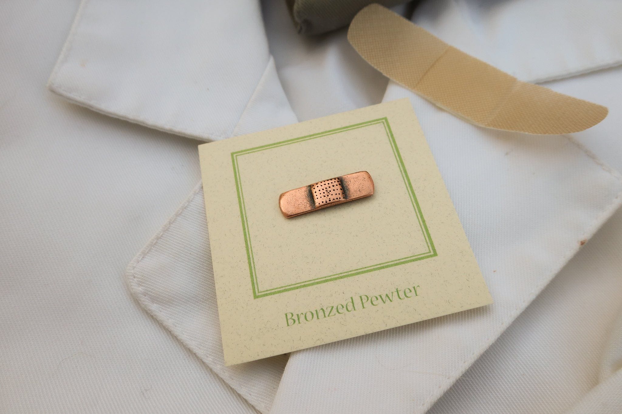 Band-Aid Copper Lapel Pin - Healing with Style | Lapel Pin Planet ...
